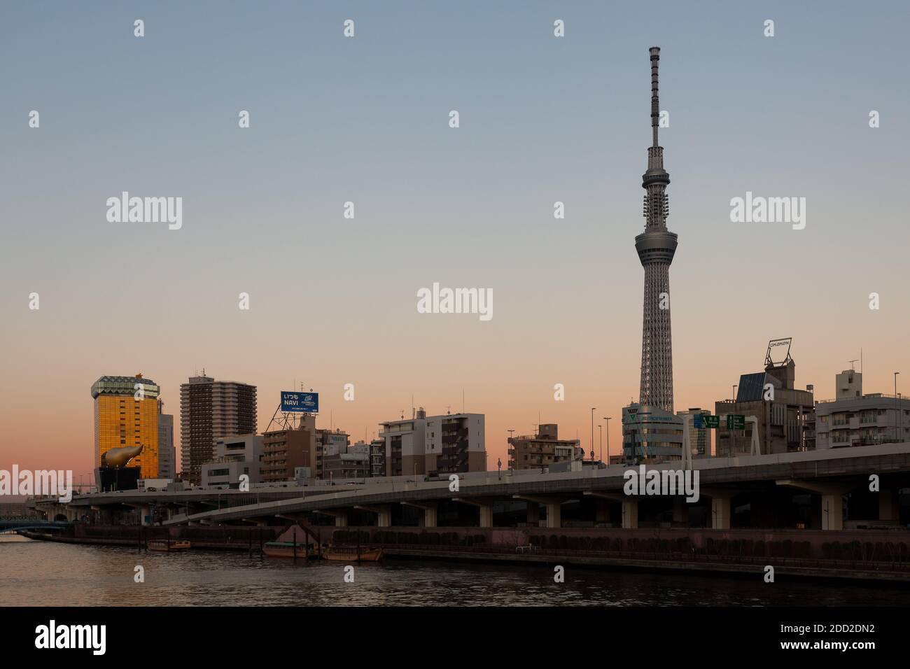 Tokyo Skytree at dusk above the Sumida Rive and Asakusa buidings. Tokyo ...