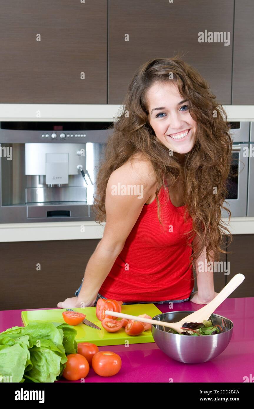 beautiful woman in the kitchen cooking healthy Stock Photo - Alamy