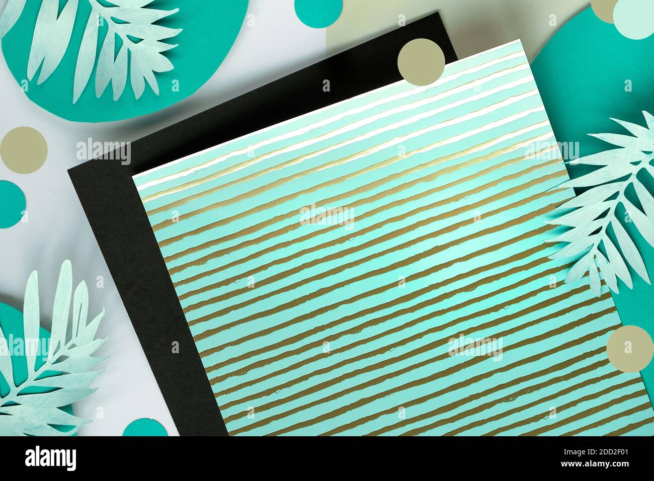 Trendy flat lay paper art on green, white and black layered paper ...