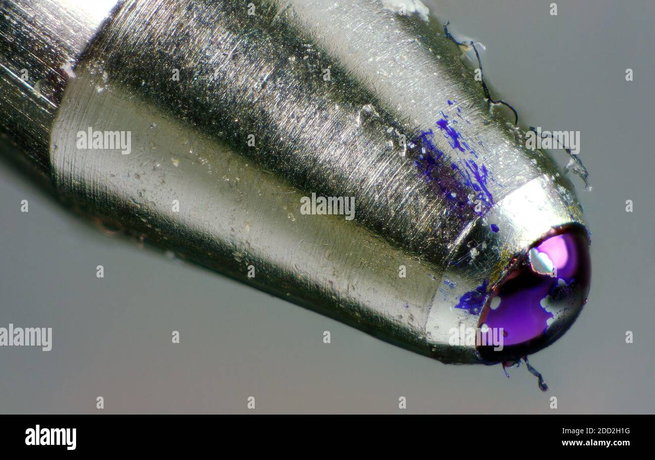 Extreme closeup macro photo of the tip of a typical ballpoint pen with ...