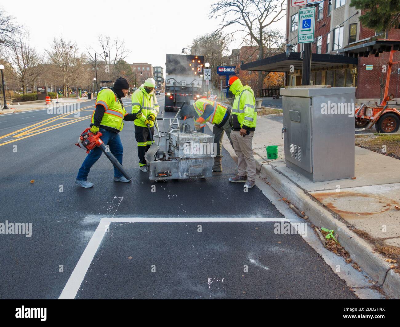 Pavement painting crew and paiinting machine Stock Photo - Alamy
