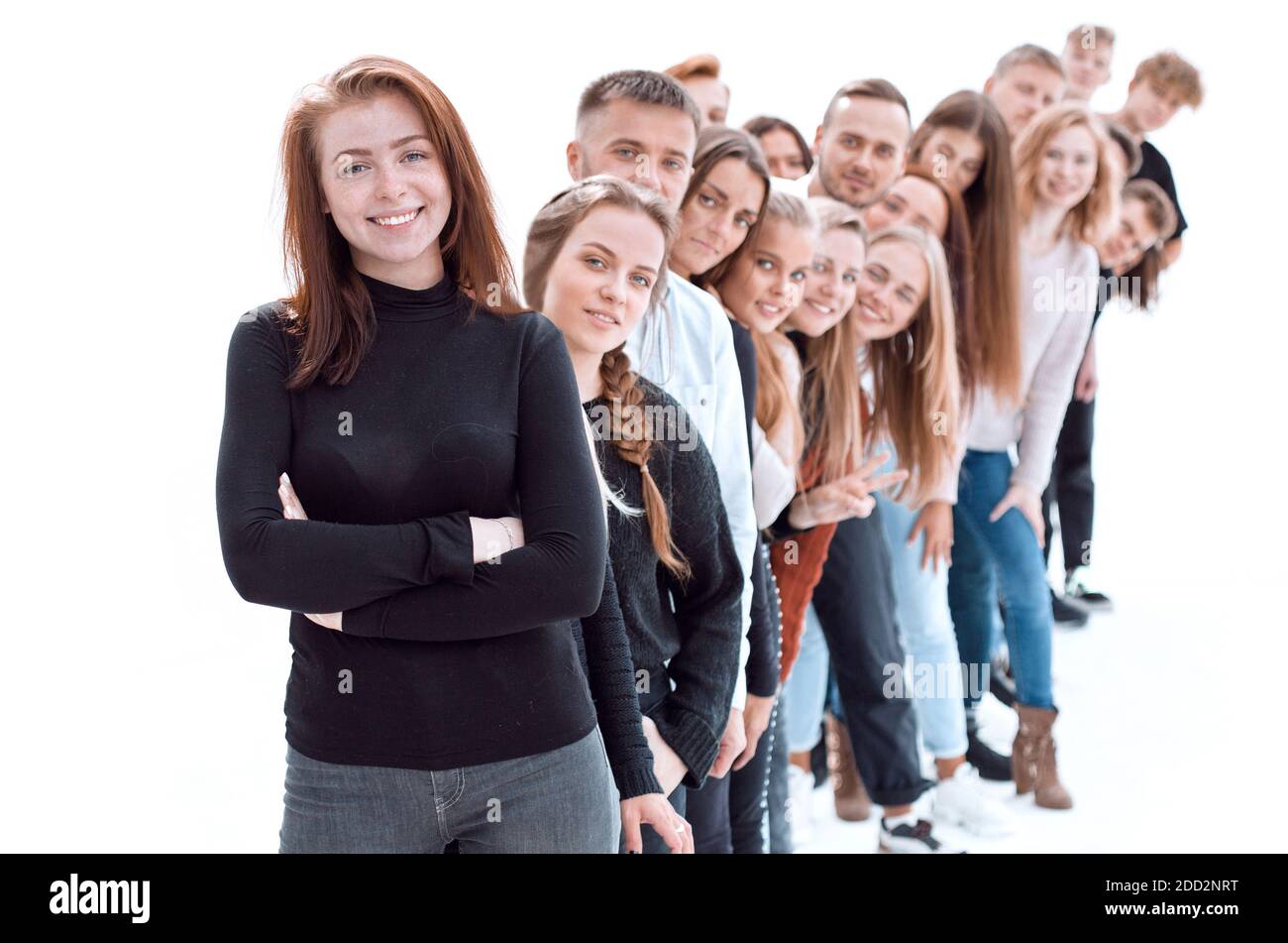 confident guy standing first in the column of young people Stock Photo ...