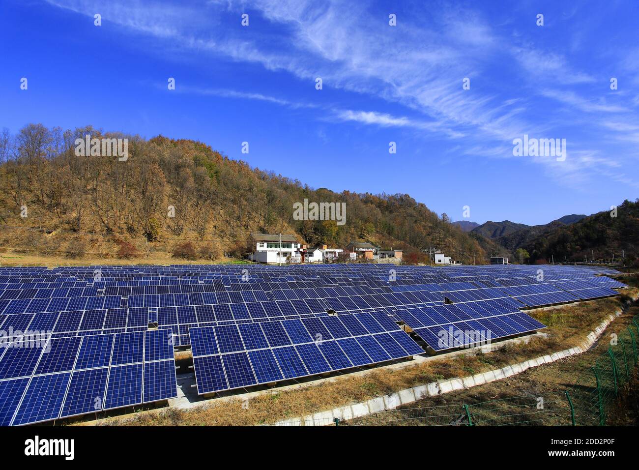 The western mountainous rural photovoltaic power station Stock Photo ...