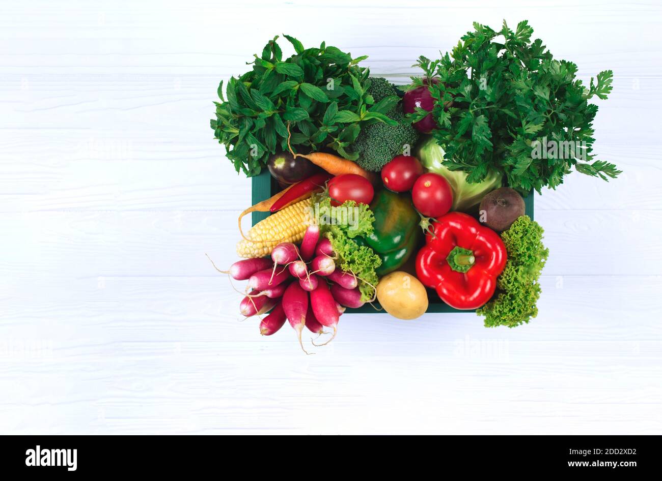 Healthy organic food background. Green wooden box full of fresh farm ...