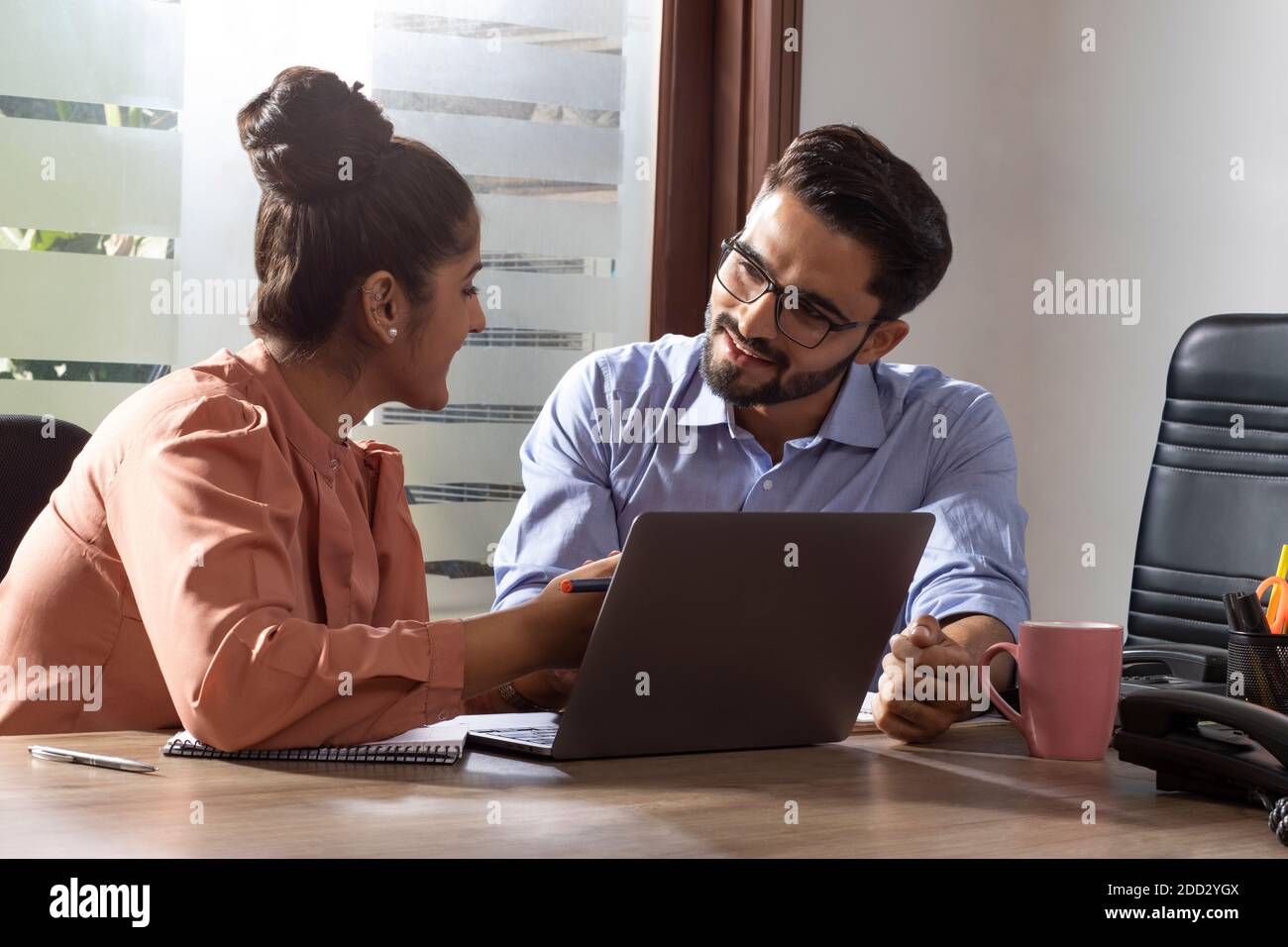Woman watching man work hi-res stock photography and images - Alamy