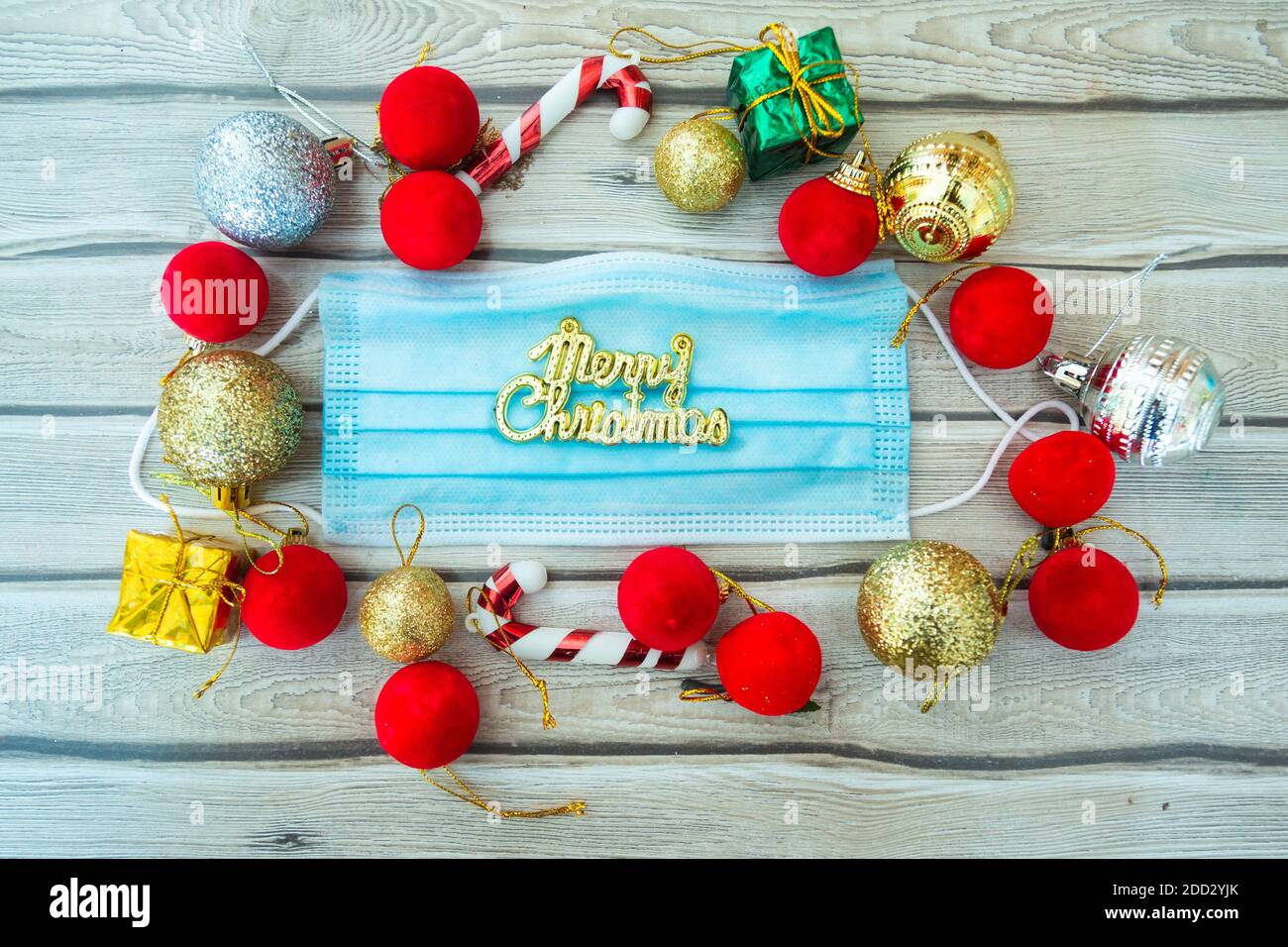 Protective surgical mask with lots of red and golden christmas balls ...