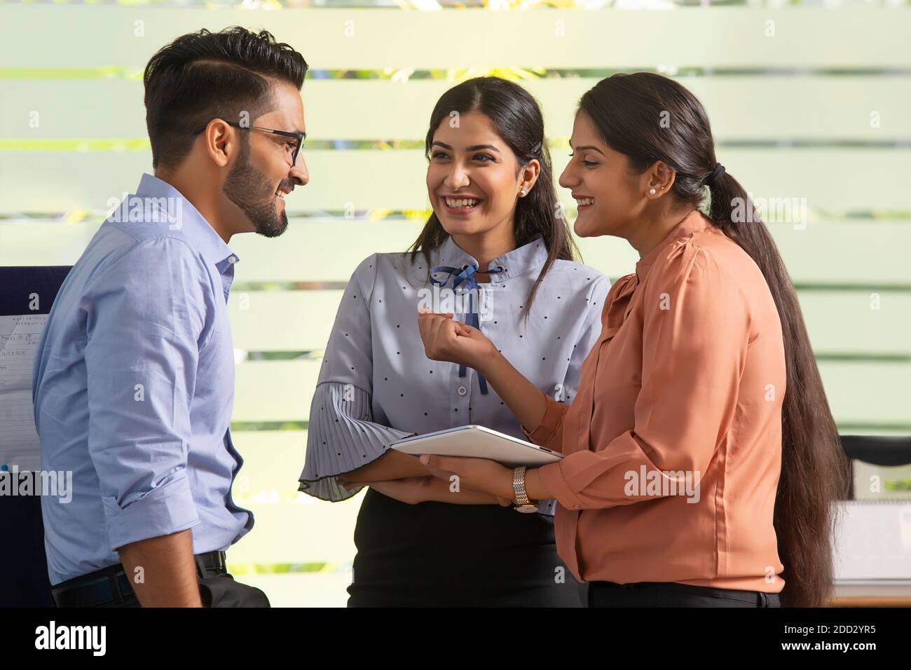 OFFICE EXECUTIVES HAPPILY TALKING TO EACH OTHER DURING BREAKTIME Stock ...