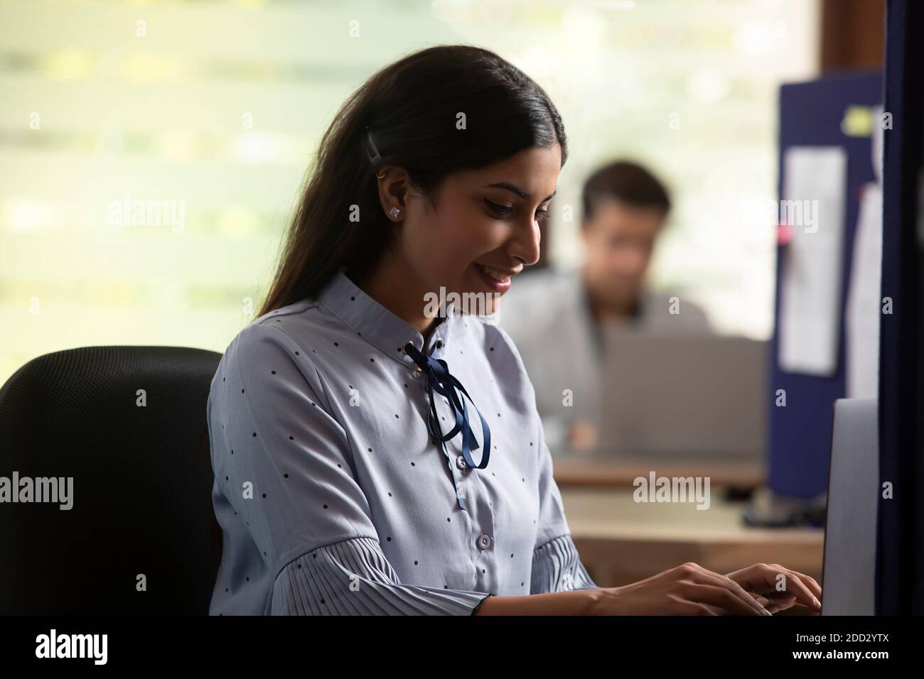 Young woman working happily hi-res stock photography and images - Alamy