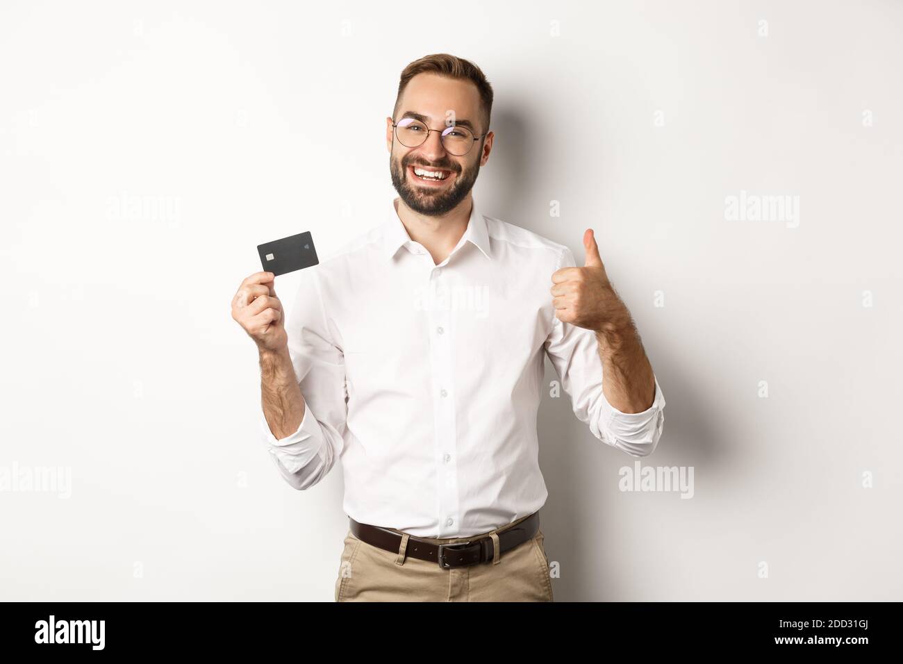 Handsome man showing his credit card and thumb up, recommending bank ...