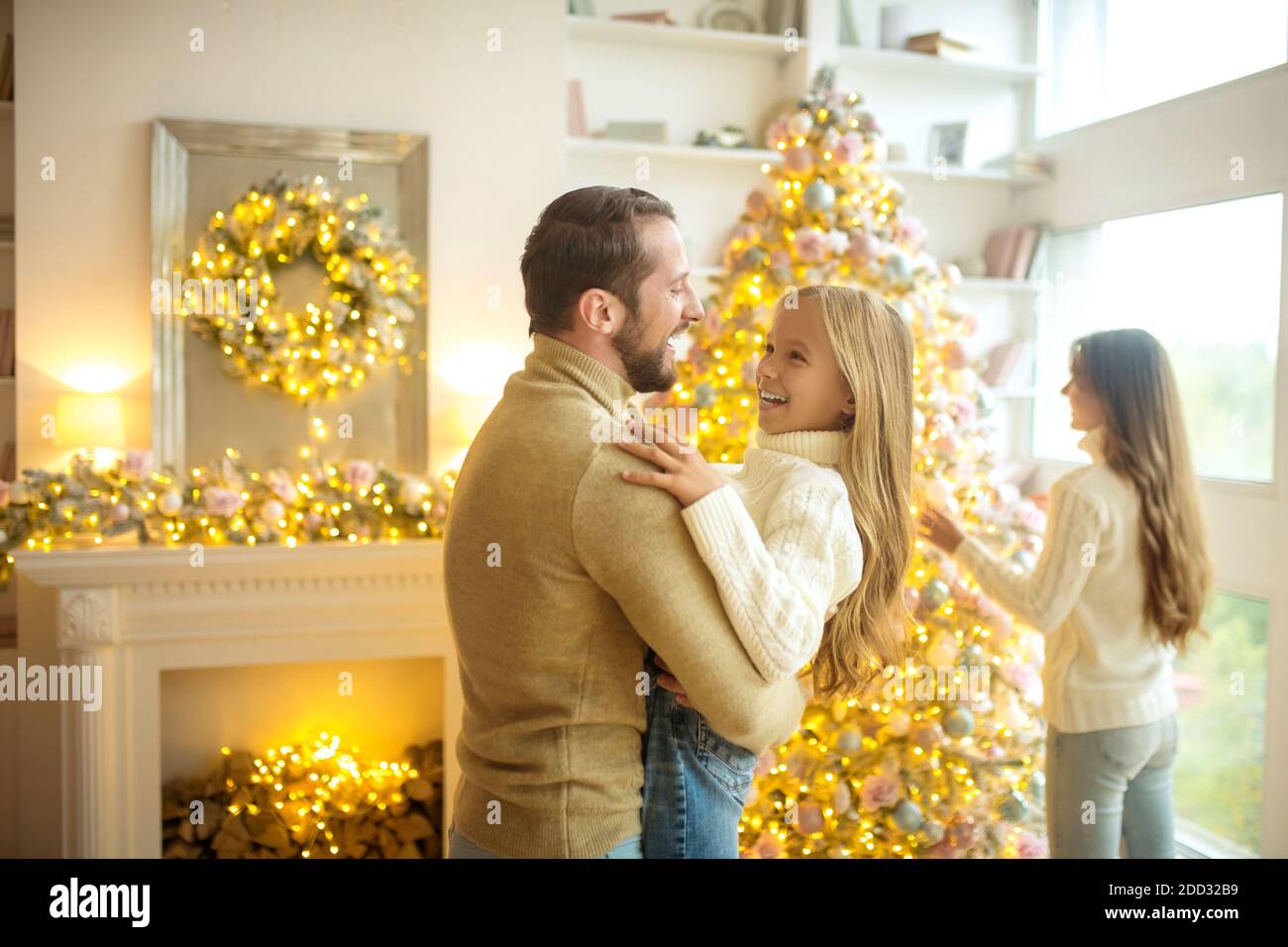 Father holding his kid and feeling happy Stock Photo - Alamy