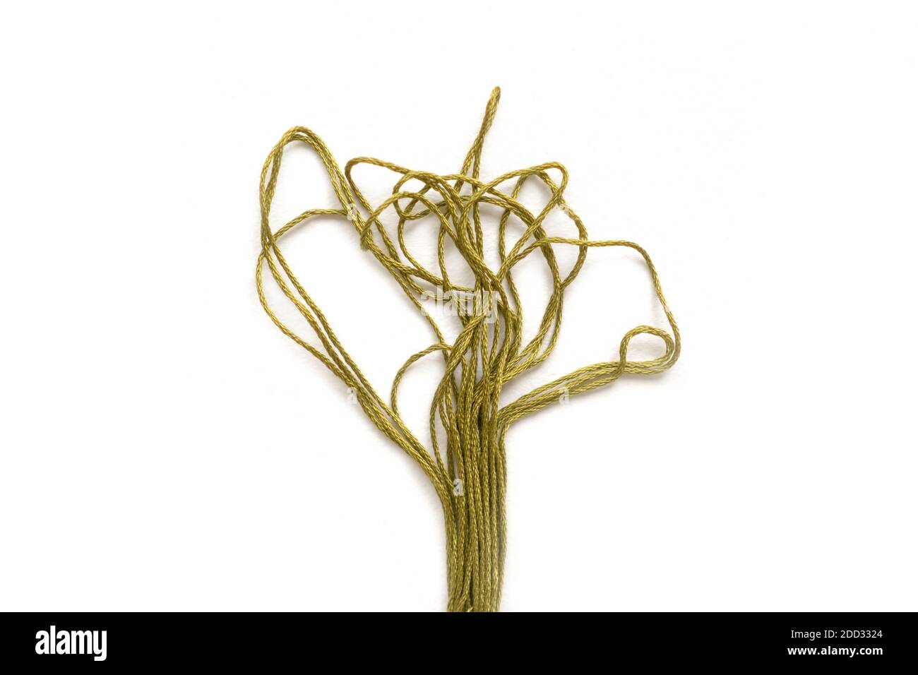 Tangled green thread on white background isolated Stock Photo - Alamy