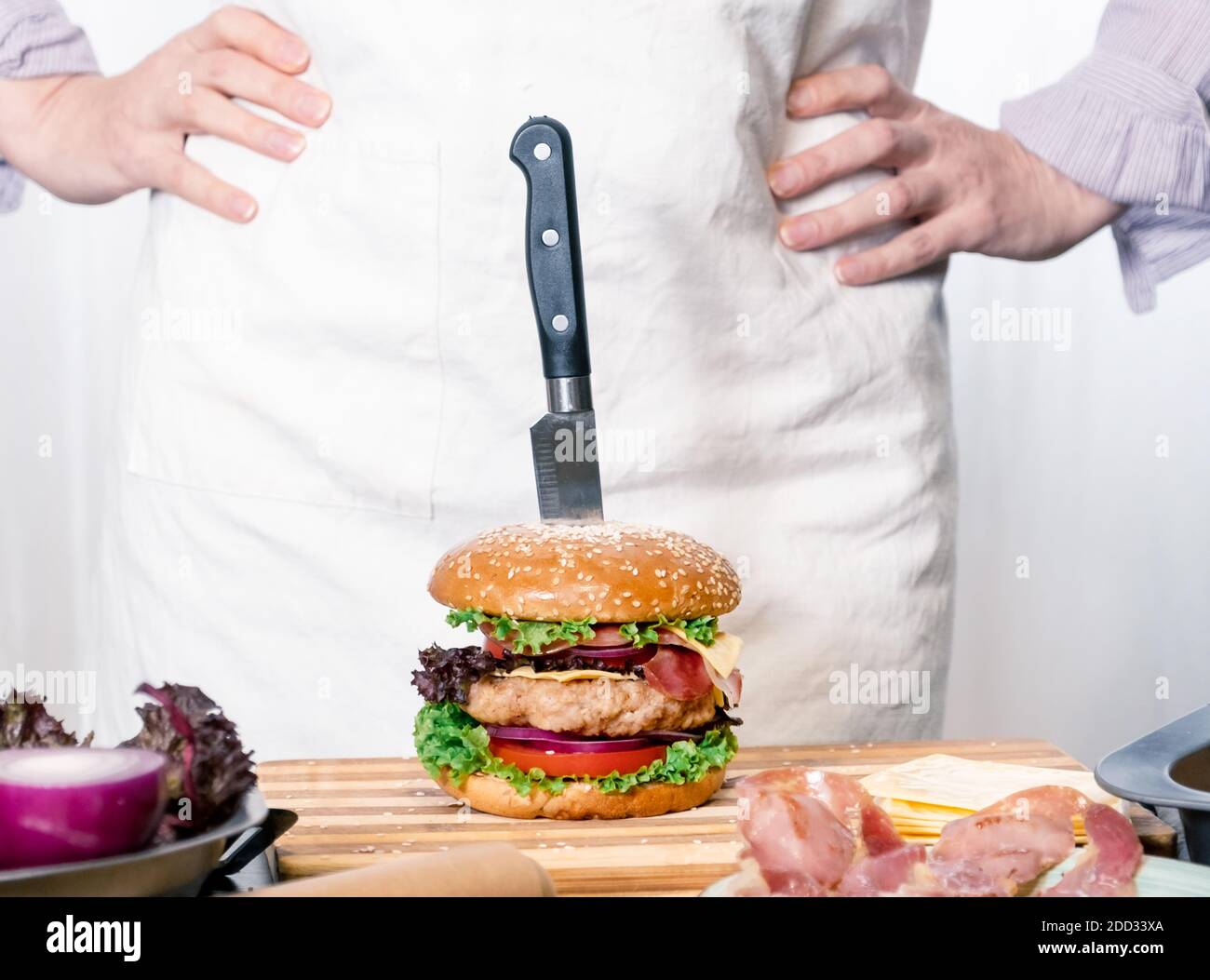 Female Chif cooking Big Burger or Cheeseburger Stock Photo - Alamy