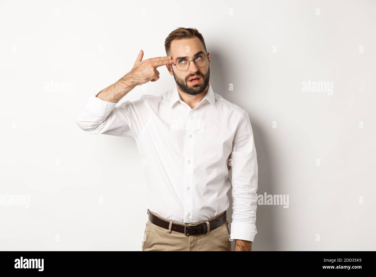 Annoyed man making shooting in head and roll eyes, standing distressed ...