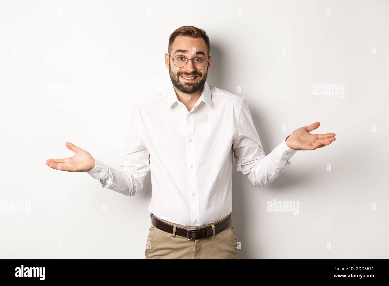Confused smiling businessman dont know, shrugging and saying sorry ...