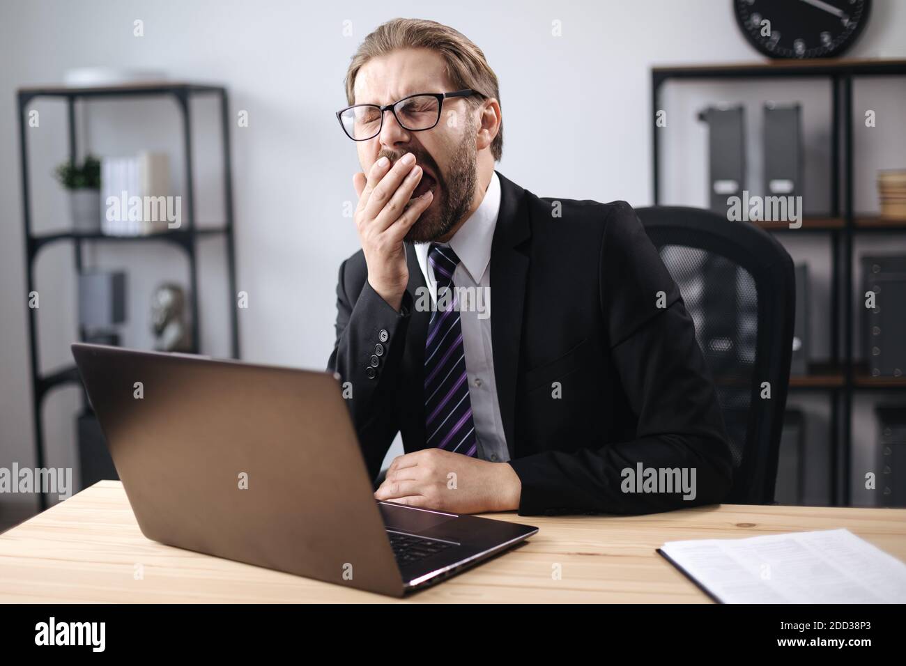 Tired yawning man laptop office hi-res stock photography and images - Alamy