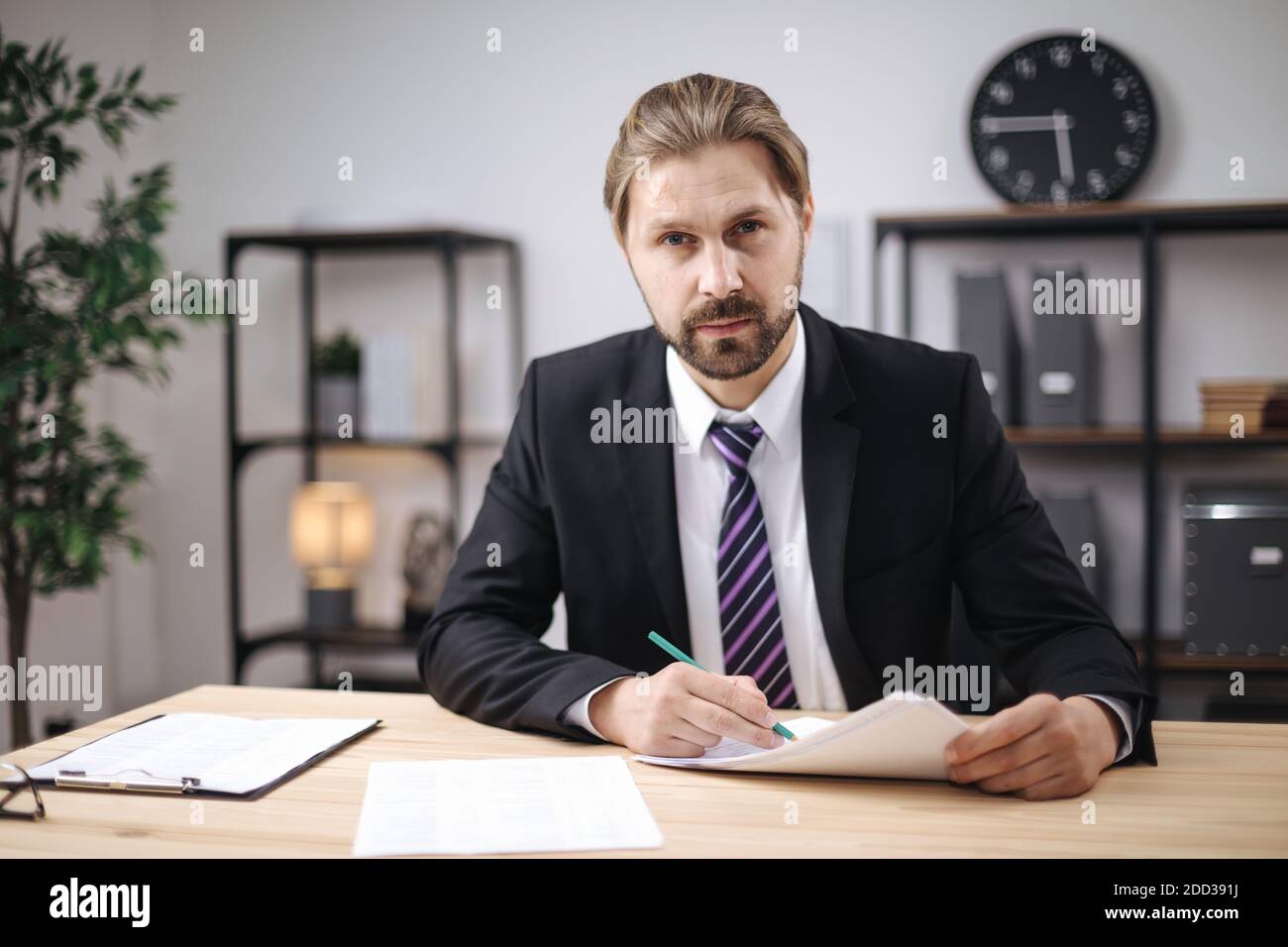 Businessman holding paper document documents hi-res stock photography ...
