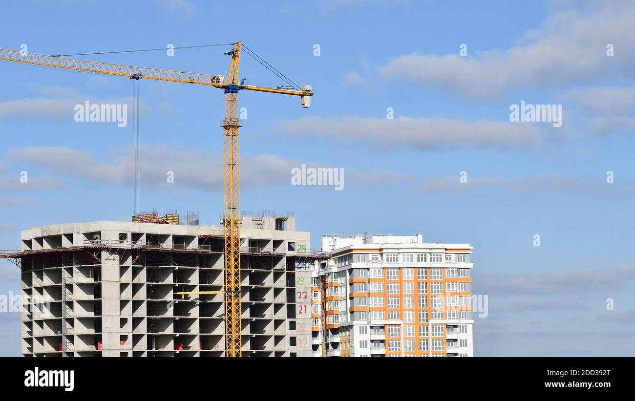 Construction site at rooftop of unfinished skyscraper with crane jib ...