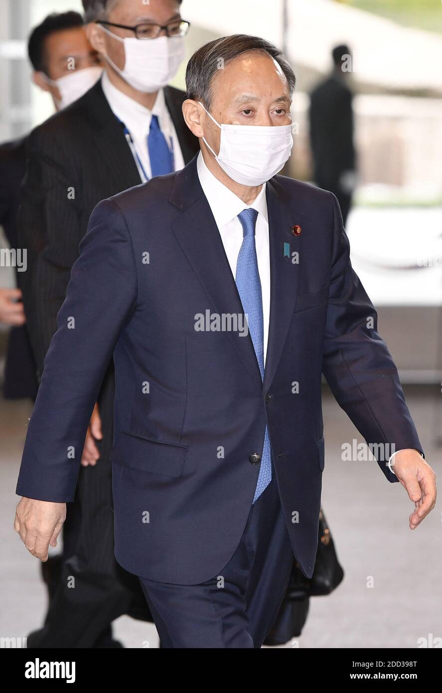 Japanese Prime Minister Yoshihide Suga arrives at his office in Tokyo ...