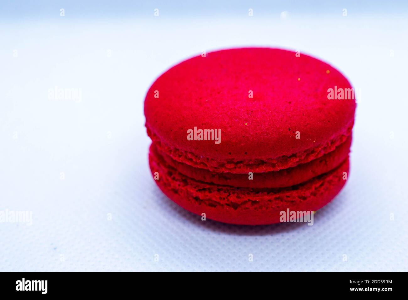 red Macaroni cookie French on white plate.Close up. Isolated Stock ...