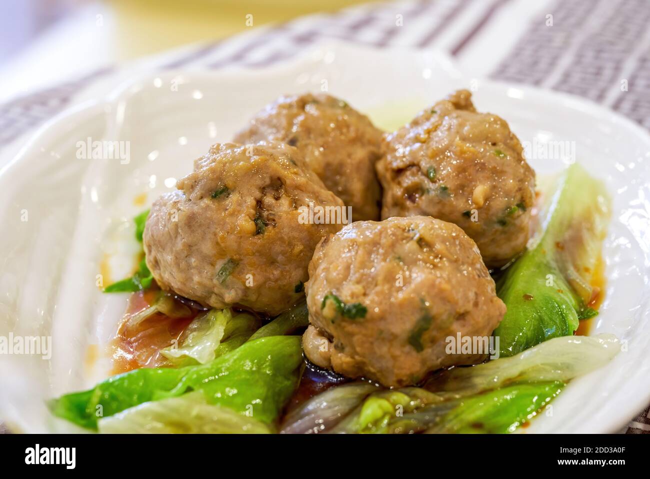 A Cantonese morning tea dim sum, handmade beef balls with parsley Stock ...
