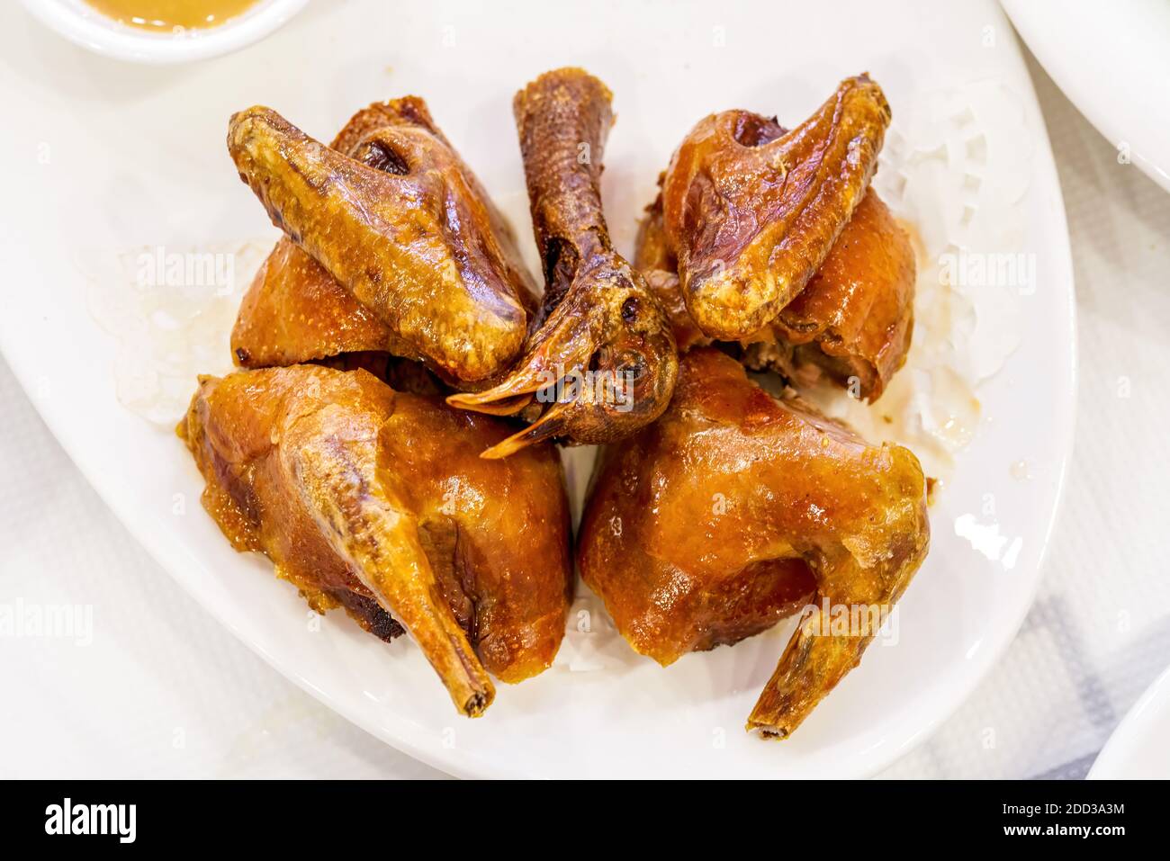 A classic Cantonese dish, braised pigeon, fried pigeon Stock Photo - Alamy