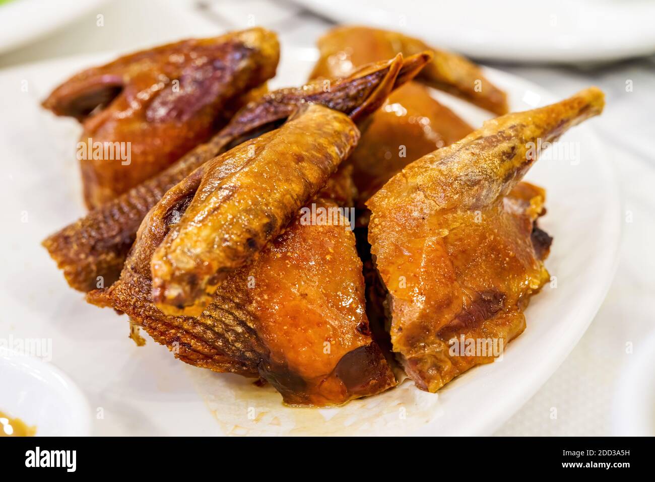 A classic Cantonese dish, braised pigeon, fried pigeon Stock Photo - Alamy