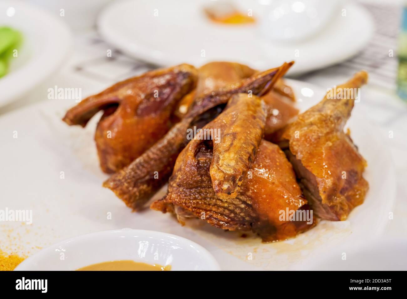 A classic Cantonese dish, braised pigeon, fried pigeon Stock Photo - Alamy