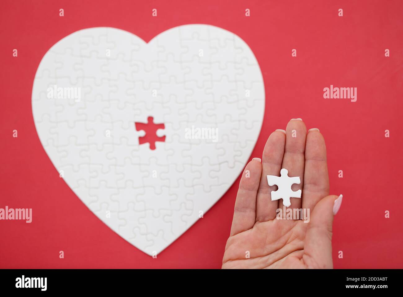 Womans hand holding puzzle hi-res stock photography and images - Alamy