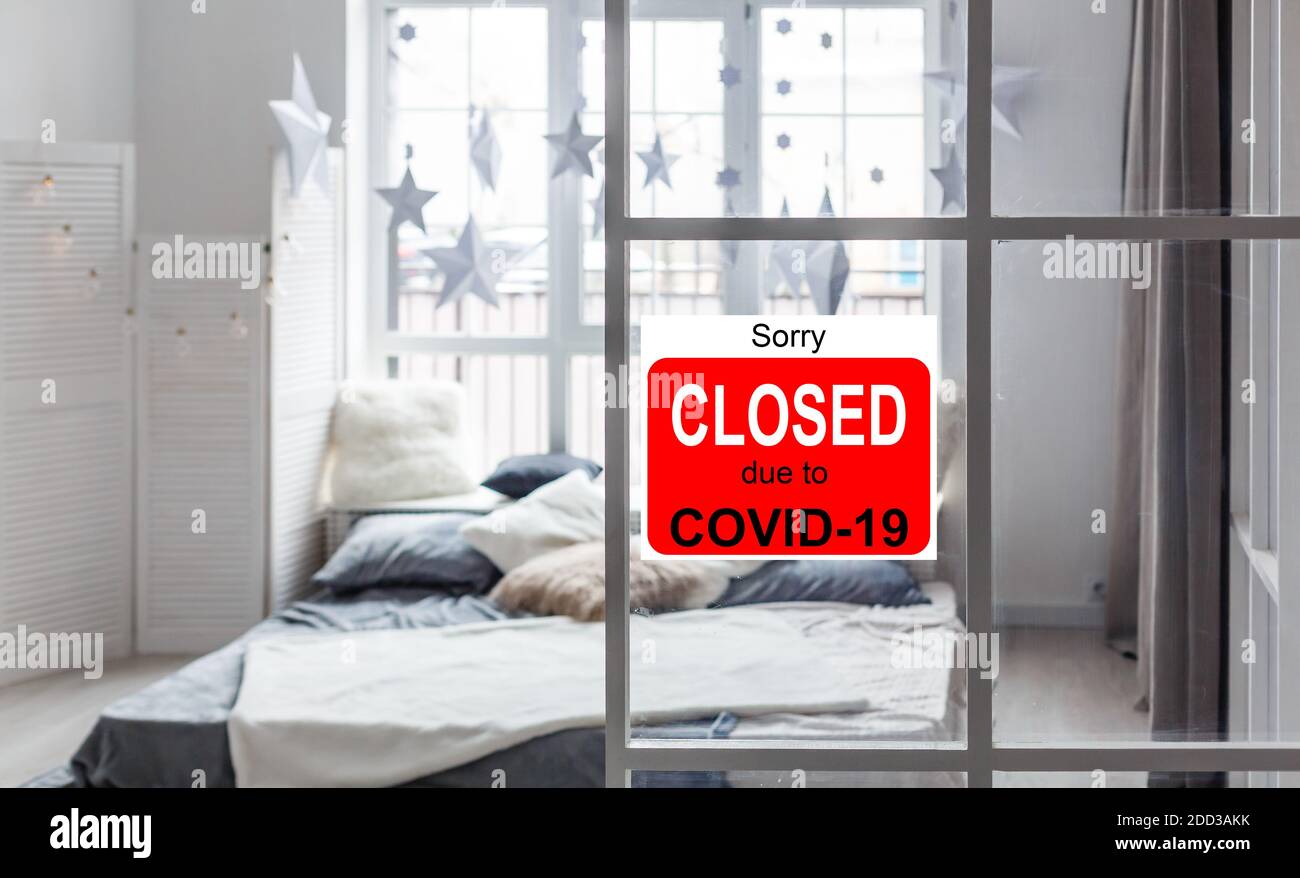 Business center closed due to COVID-19, sign with sorry in door window ...