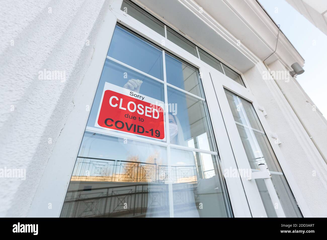 Business center closed due to COVID-19, sign with sorry in door window ...