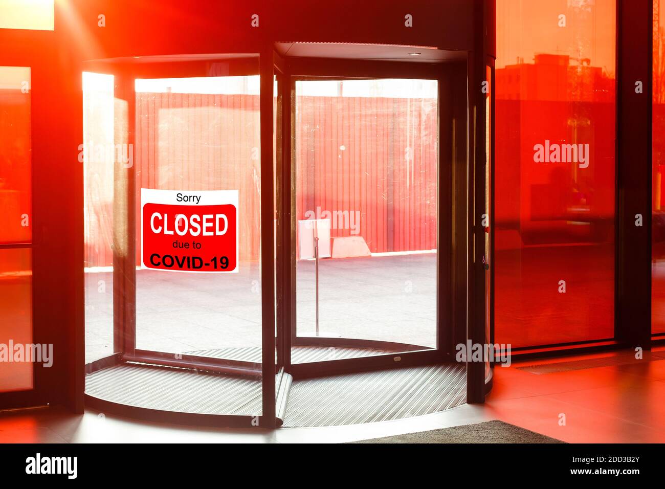 Business center closed due to COVID-19, sign with sorry in door window ...