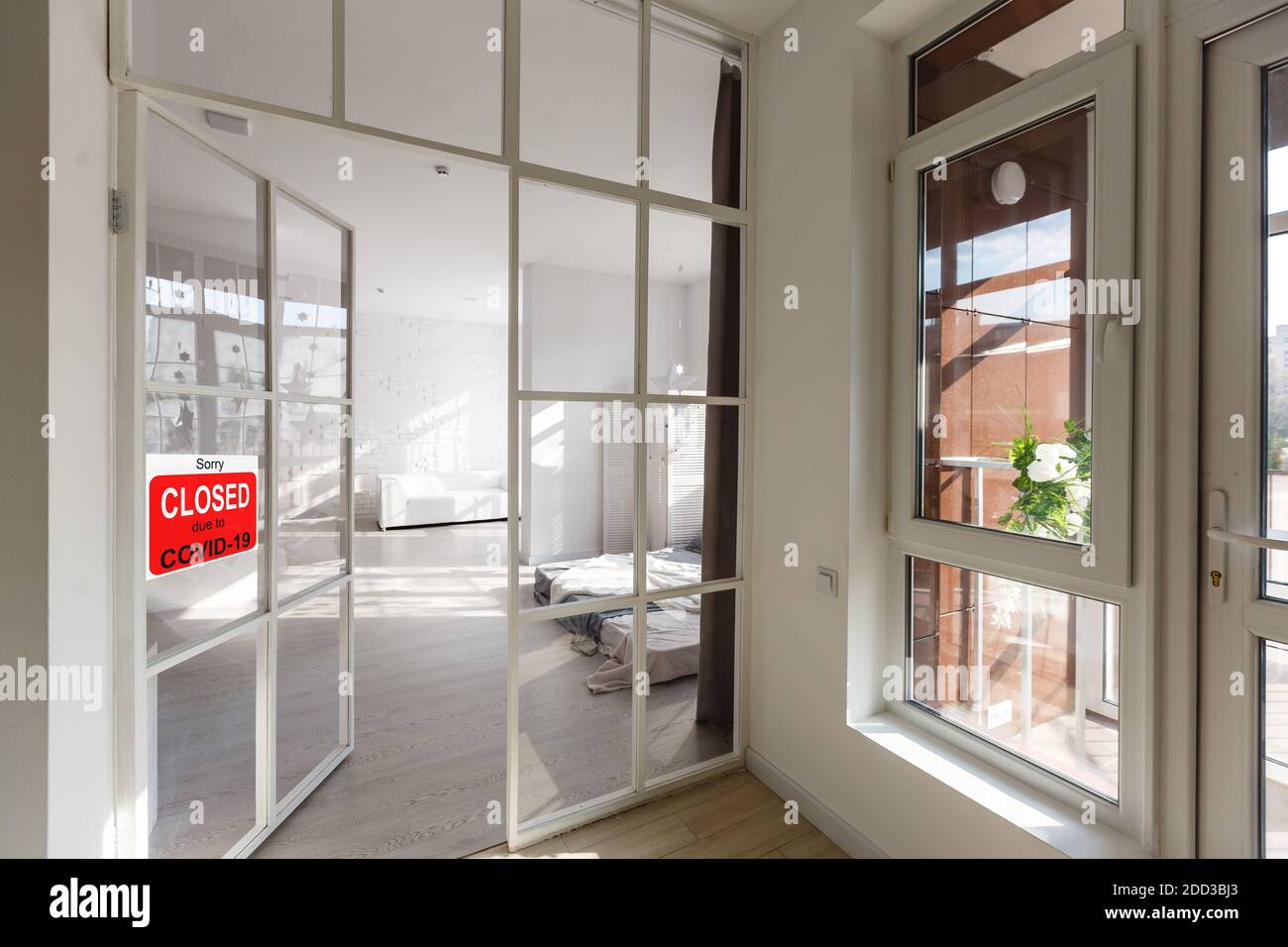 Business center closed due to COVID-19, sign with sorry in door window ...