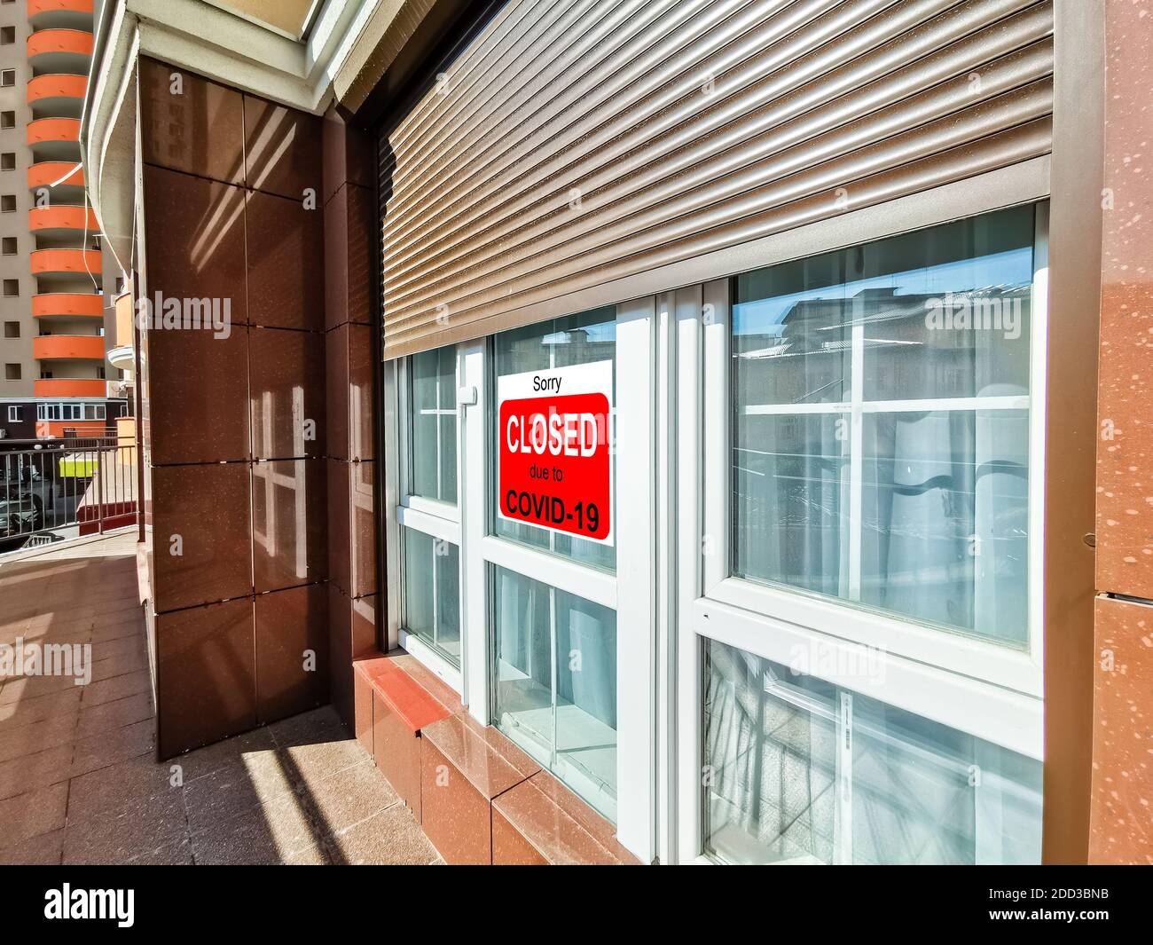 Business center closed due to COVID-19, sign with sorry in door window ...