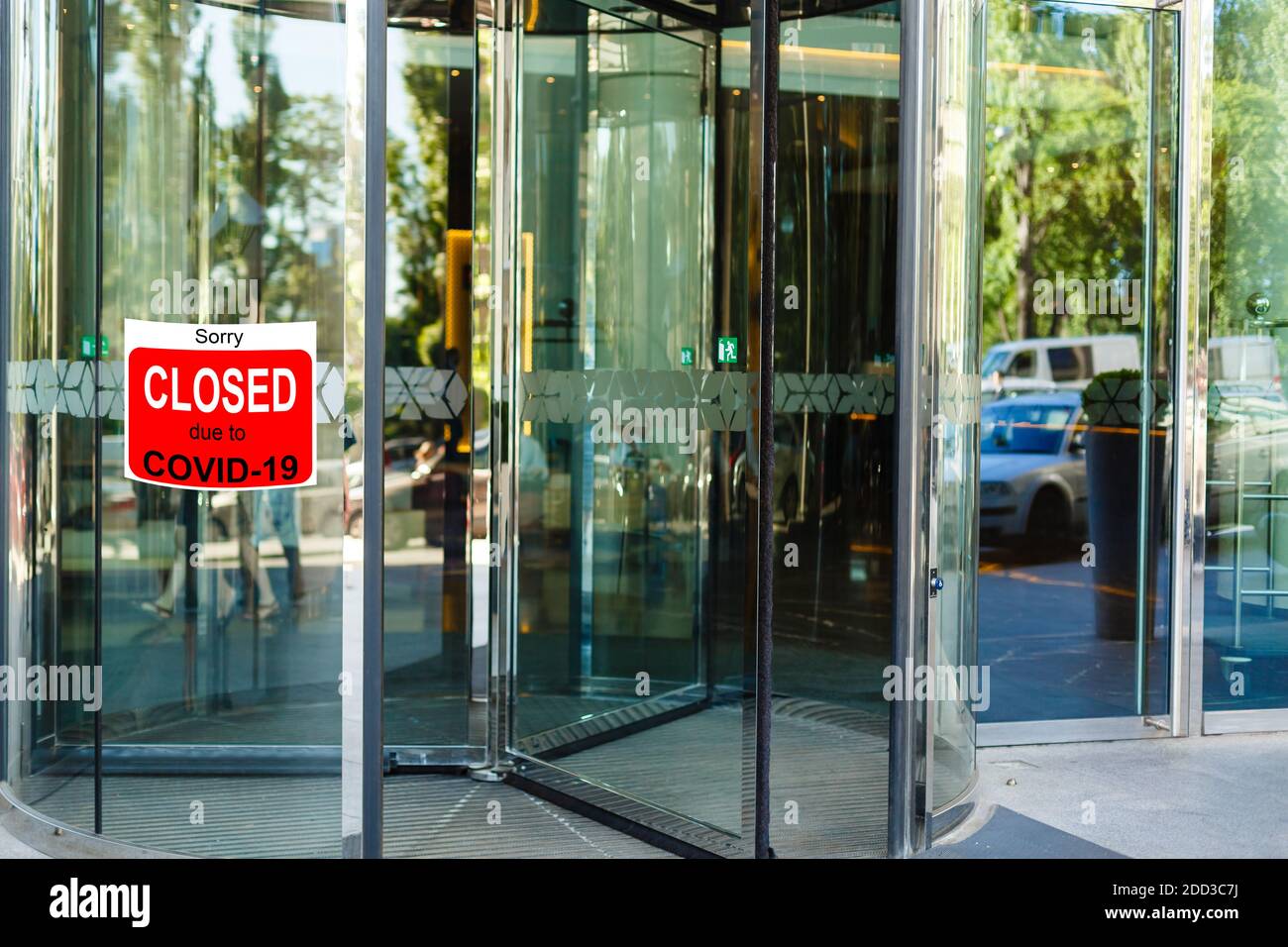 Business center closed due to COVID-19, sign with sorry in door window ...