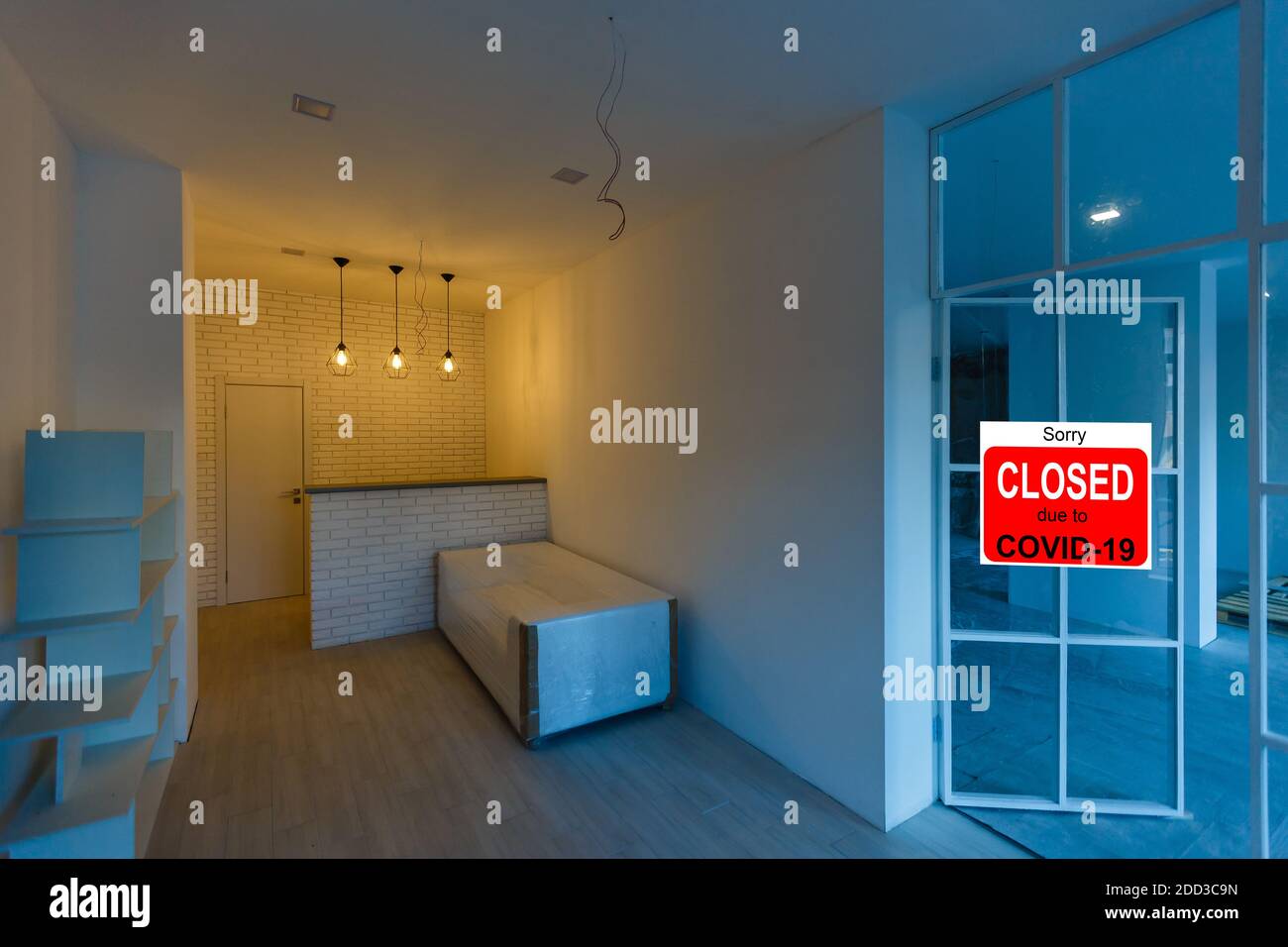 Business center closed due to COVID-19, sign with sorry in door window ...