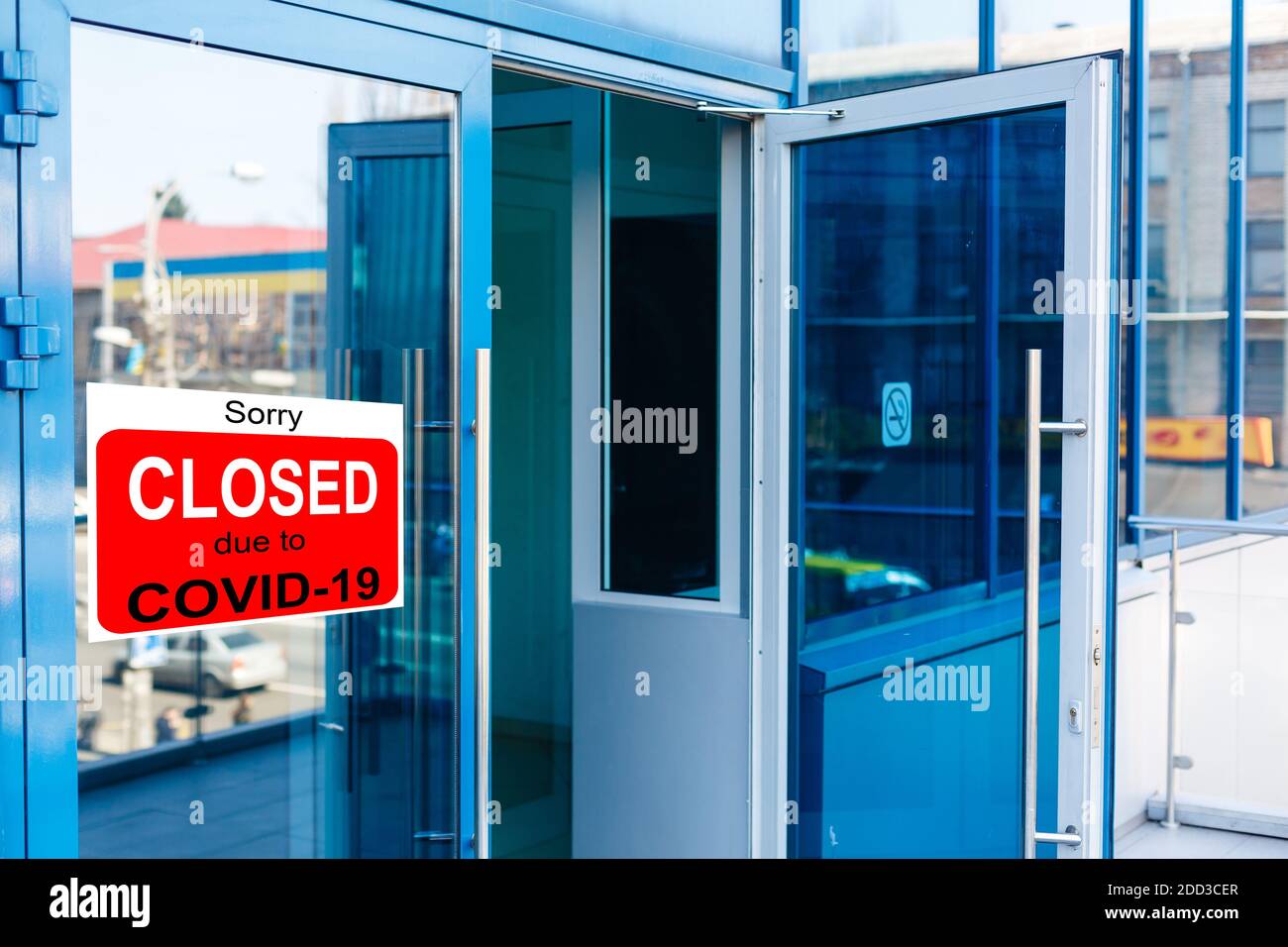 Business center closed due to COVID-19, sign with sorry in door window ...