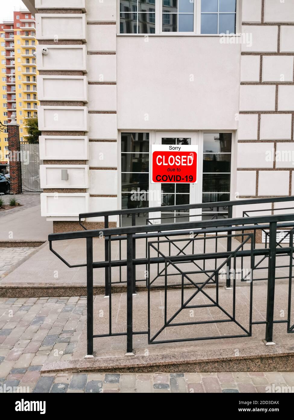 Business center closed due to COVID-19, sign with sorry in door window ...