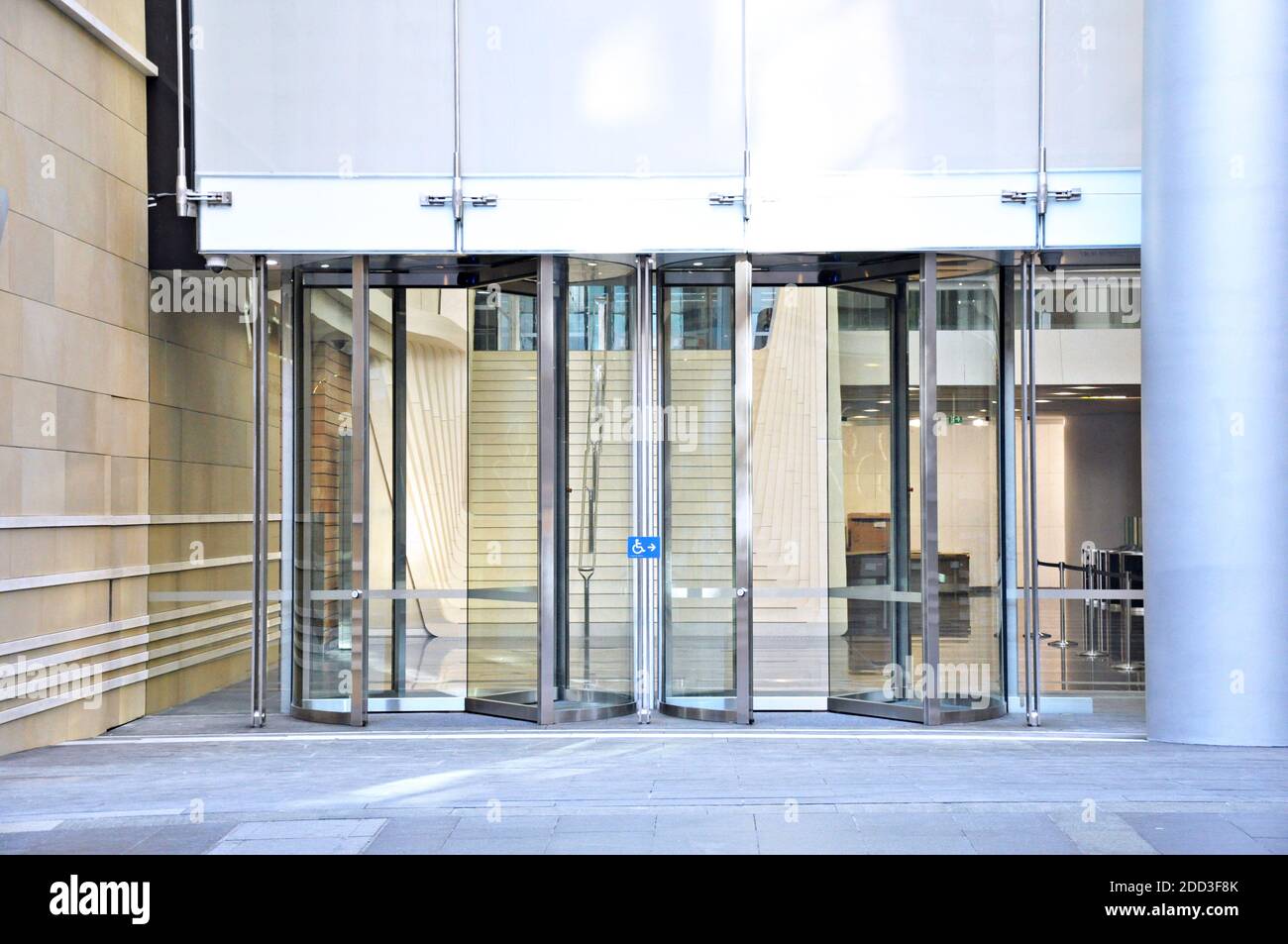 Front revolving transparent automatic rotate door Stock Photo - Alamy