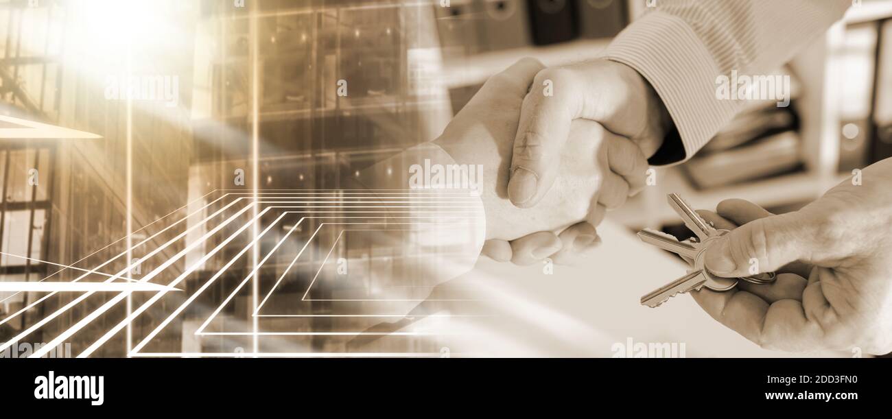Realtor shaking hands with his client by delivering the keys, closeup ...