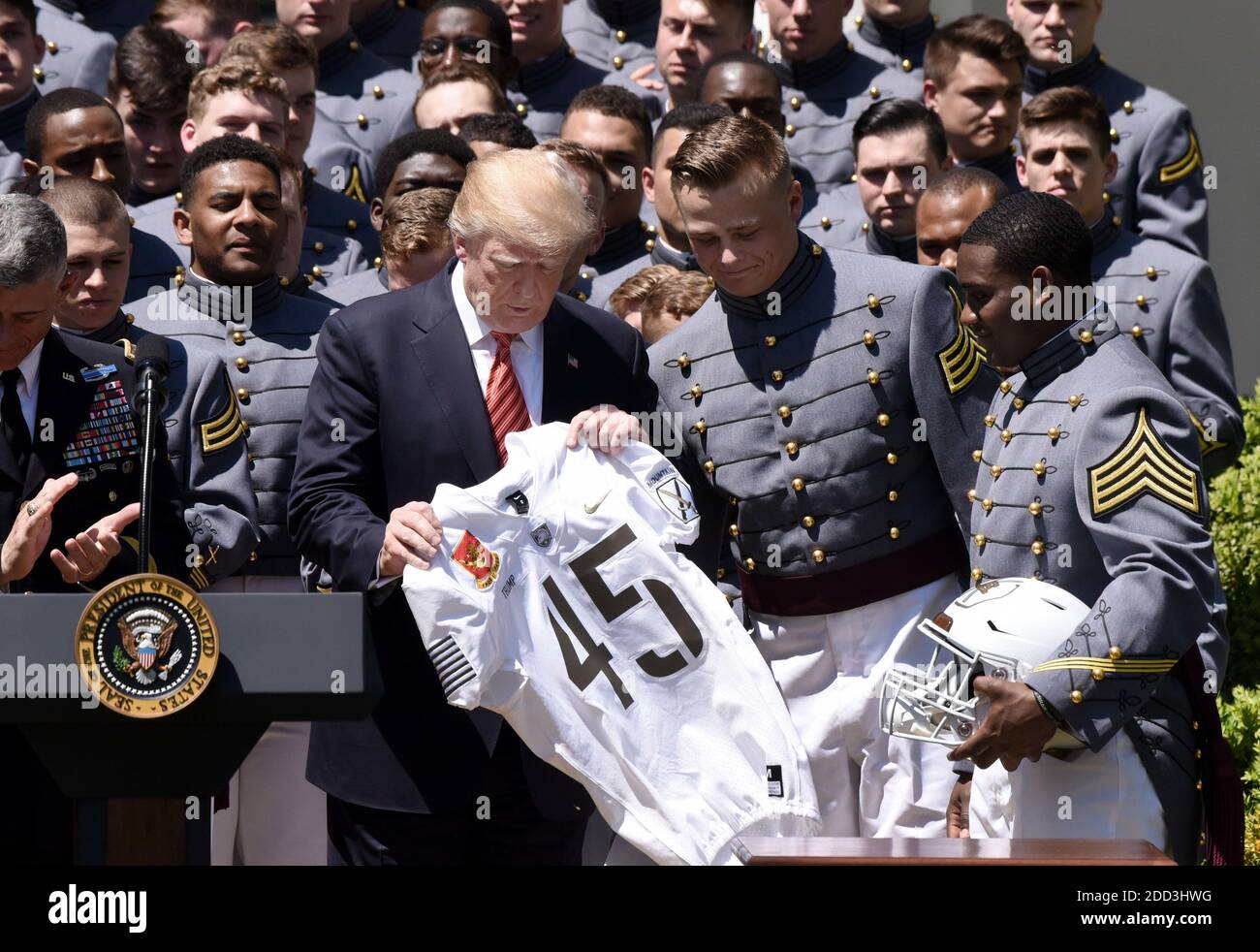 U.S President Donald Trump is presented with a helmet and a jersey ...