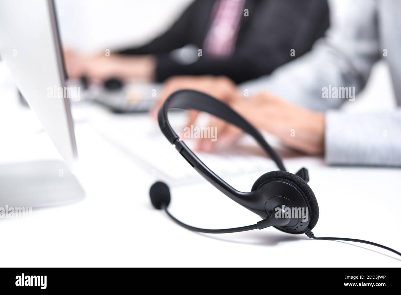 Microphone headset on the table in call center Stock Photo - Alamy