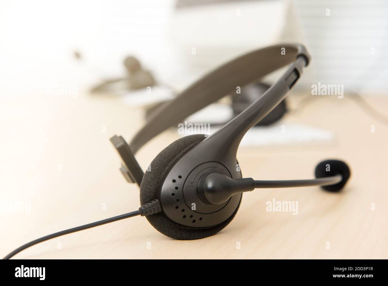 Microphone headset on the table in call center Stock Photo - Alamy