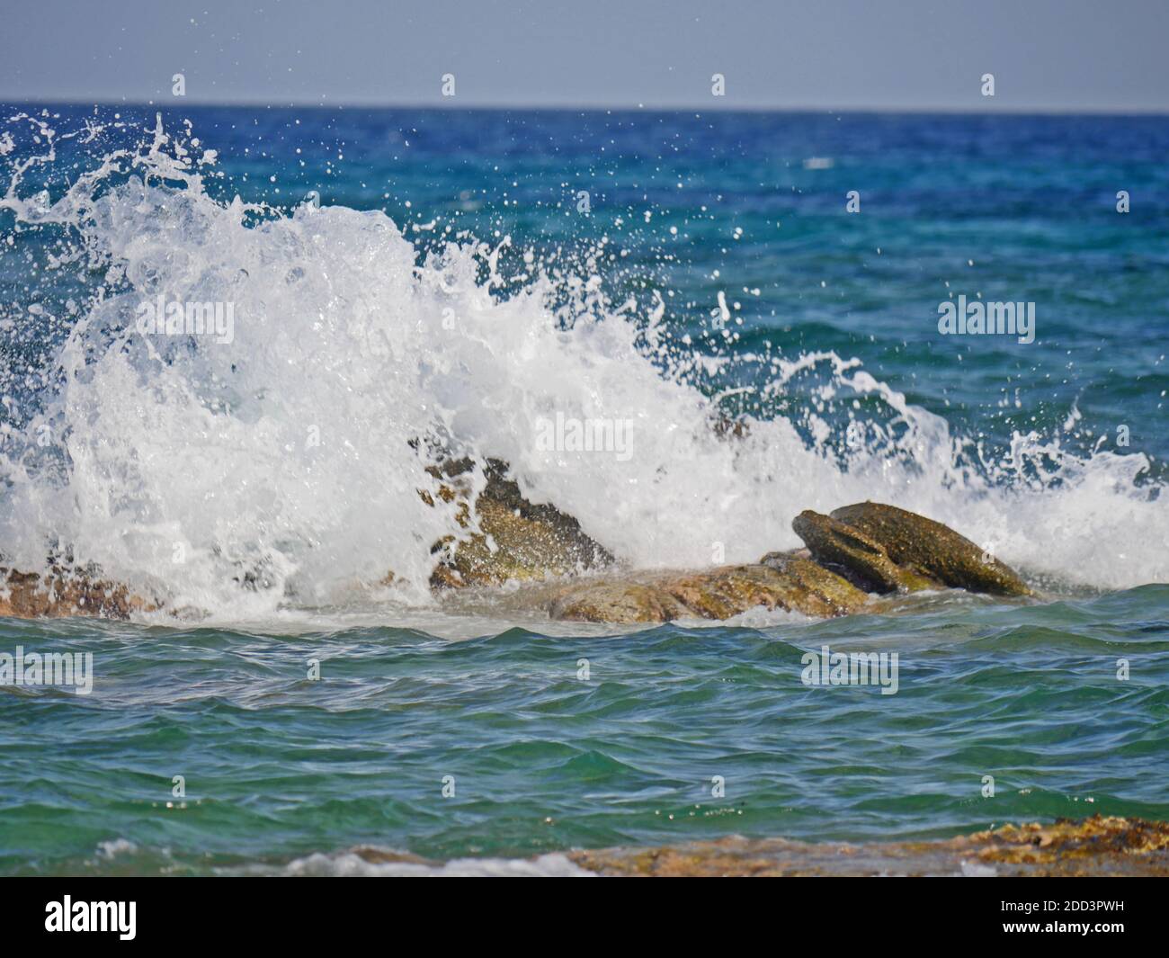 Waves crashing against the rock, natural background Stock Photo - Alamy