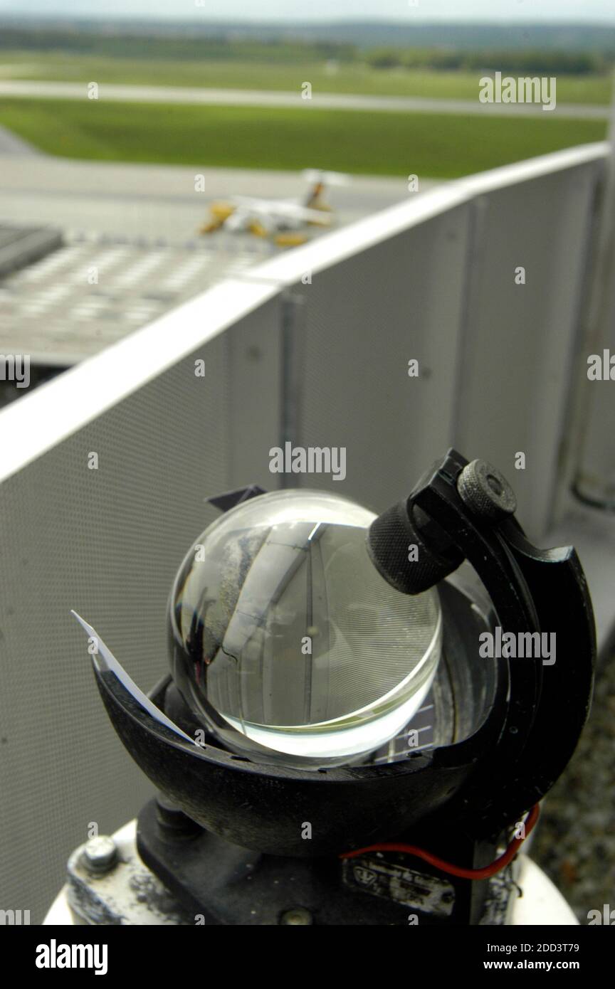 a heliograph or sunshine recorder for measuring the amount of sunshine ...