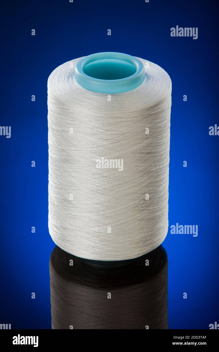 The cone of colored thread isolated on a white background Stock Photo ...