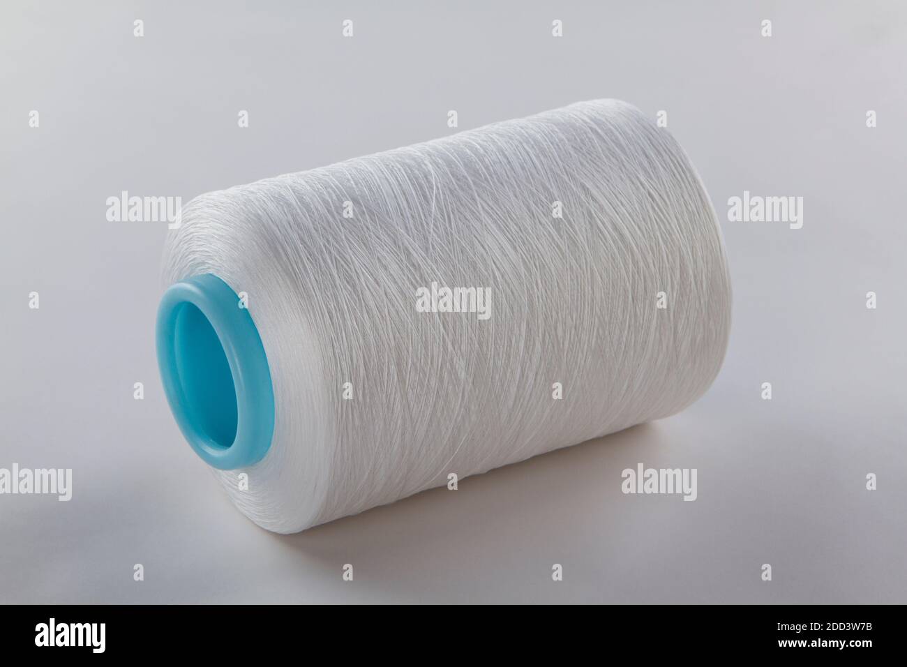 The cone of colored thread isolated on a white background Stock Photo ...