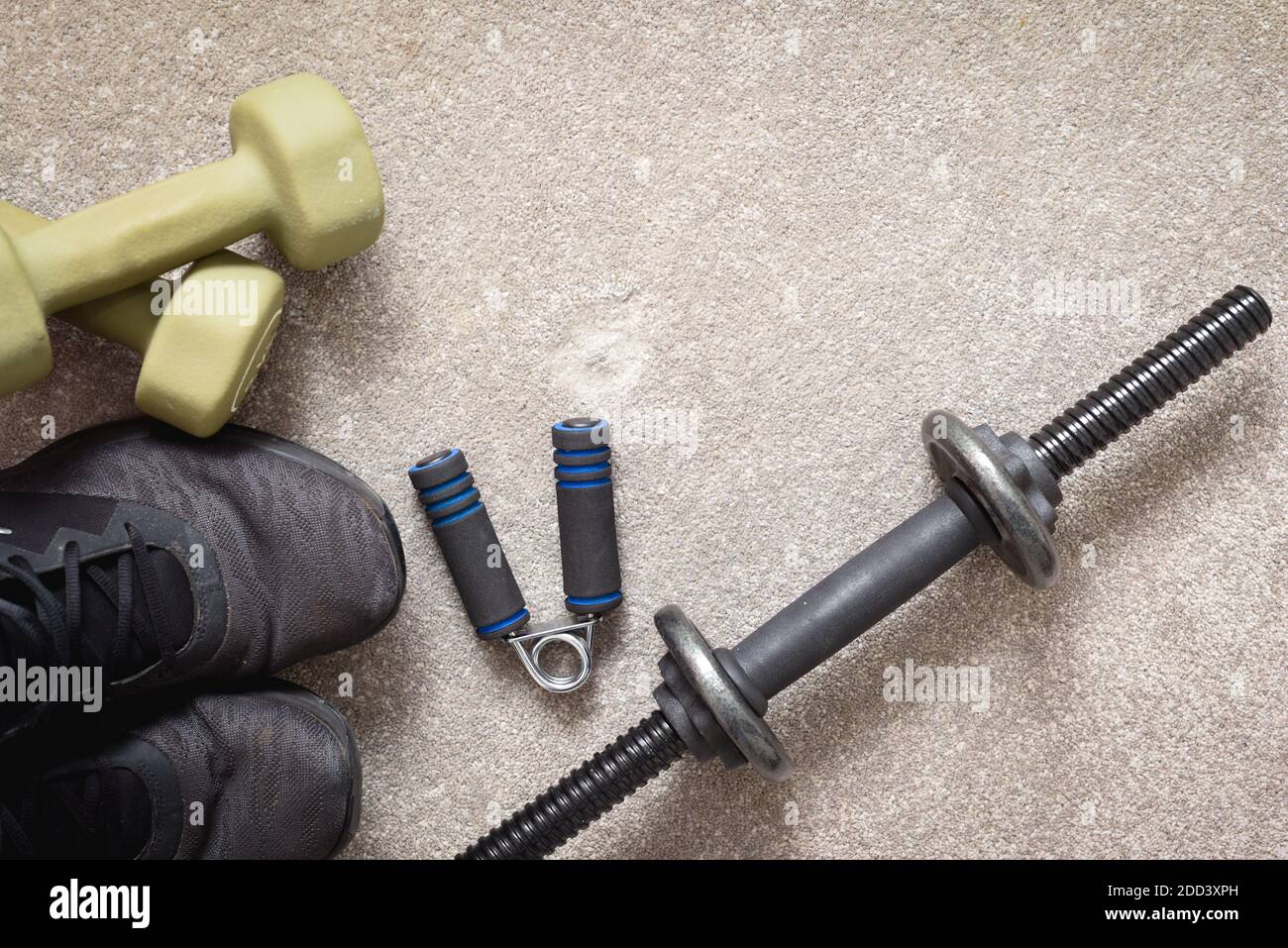 Selection of weights and objects for exercising at home Stock Photo - Alamy