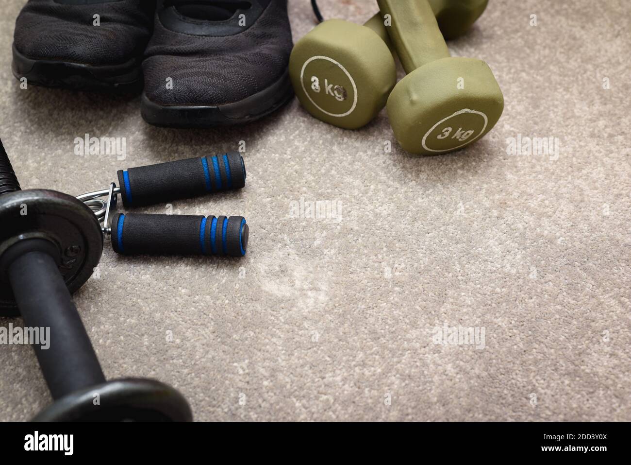 Selection of weights and objects for exercising at home Stock Photo - Alamy