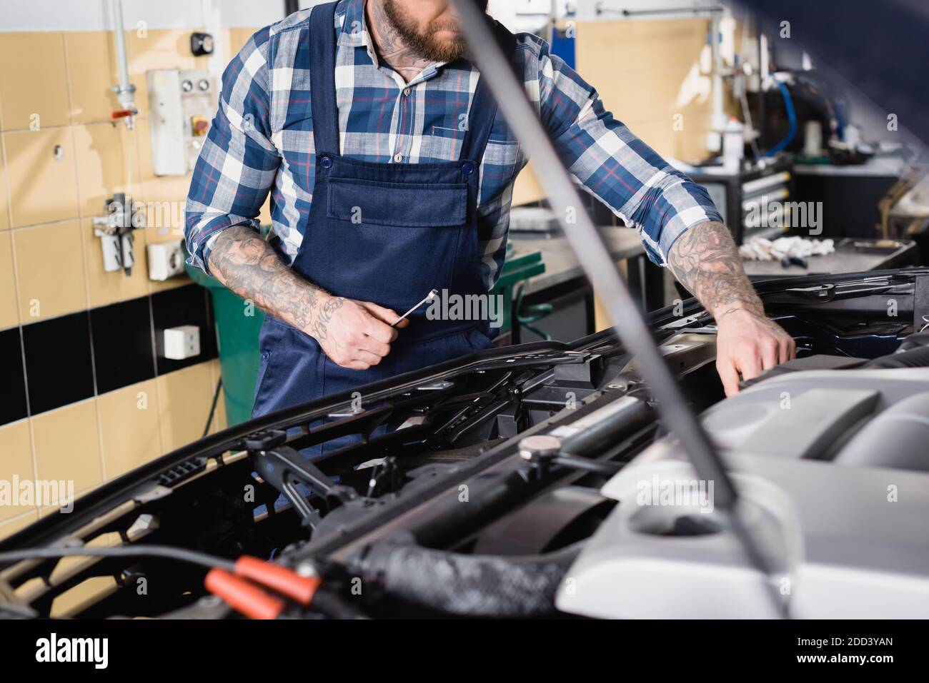 Person in uniform examining vehicles hi-res stock photography and ...