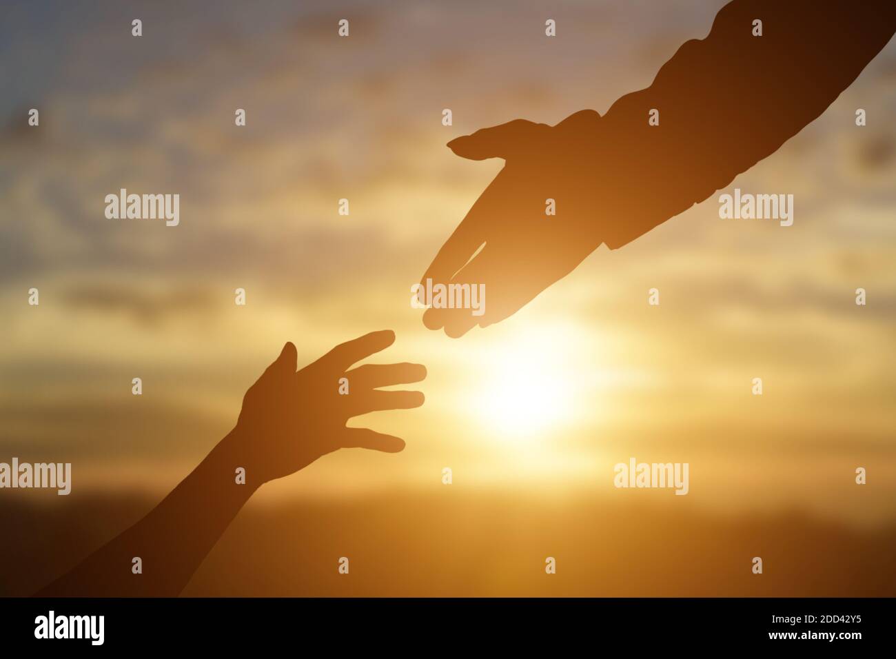 Silhouette of giving a helping hand, hope and support each other over ...